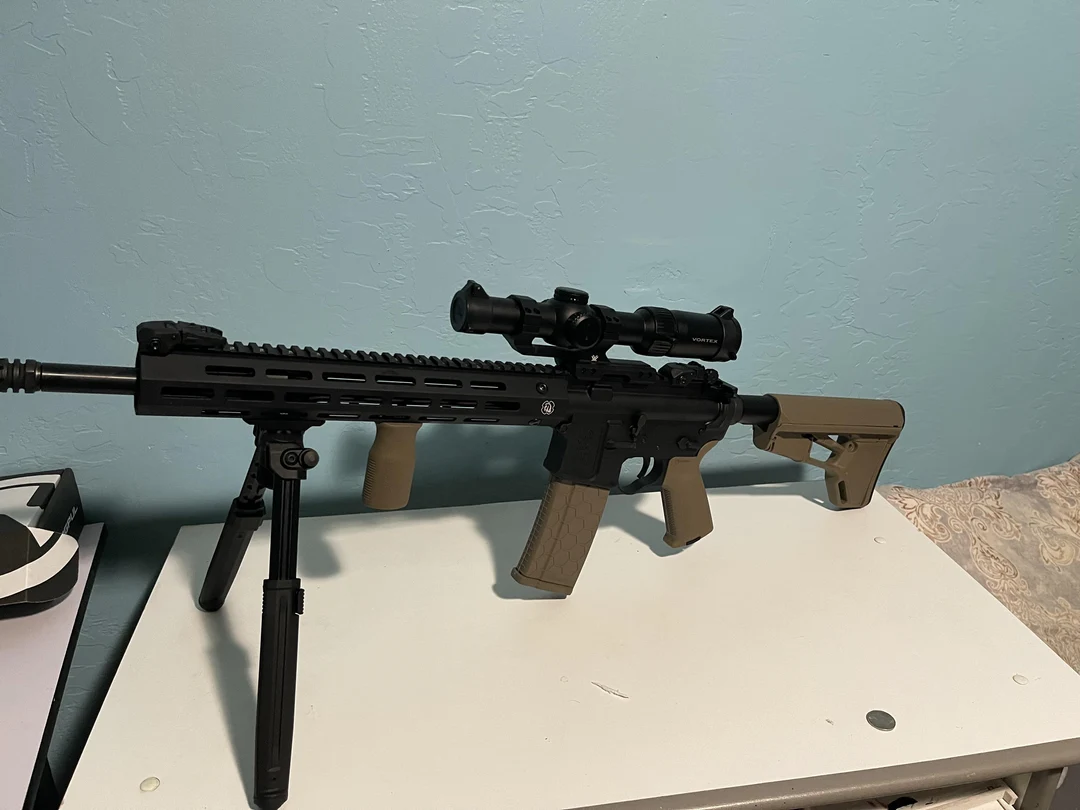 My first ever Ar15, its a troy SPC A4 with some magpul grips and stock and a Vortex strike eagle ...