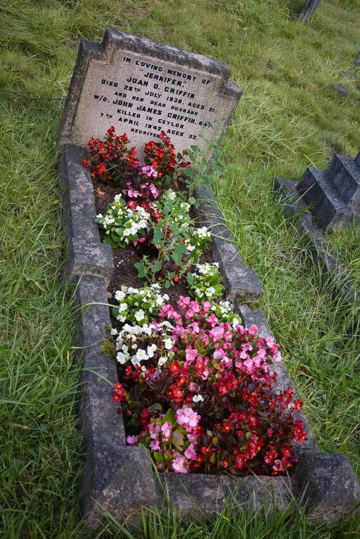Fresh flowerbed on a double grave from 1942 | Scrolller