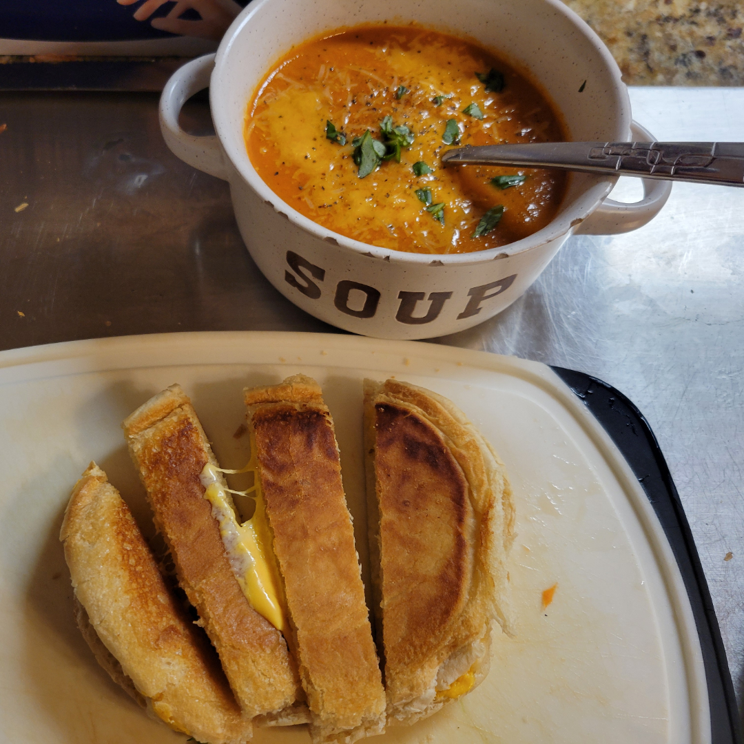 Grilled cheese on a bun with tomato Basil soup | Scrolller