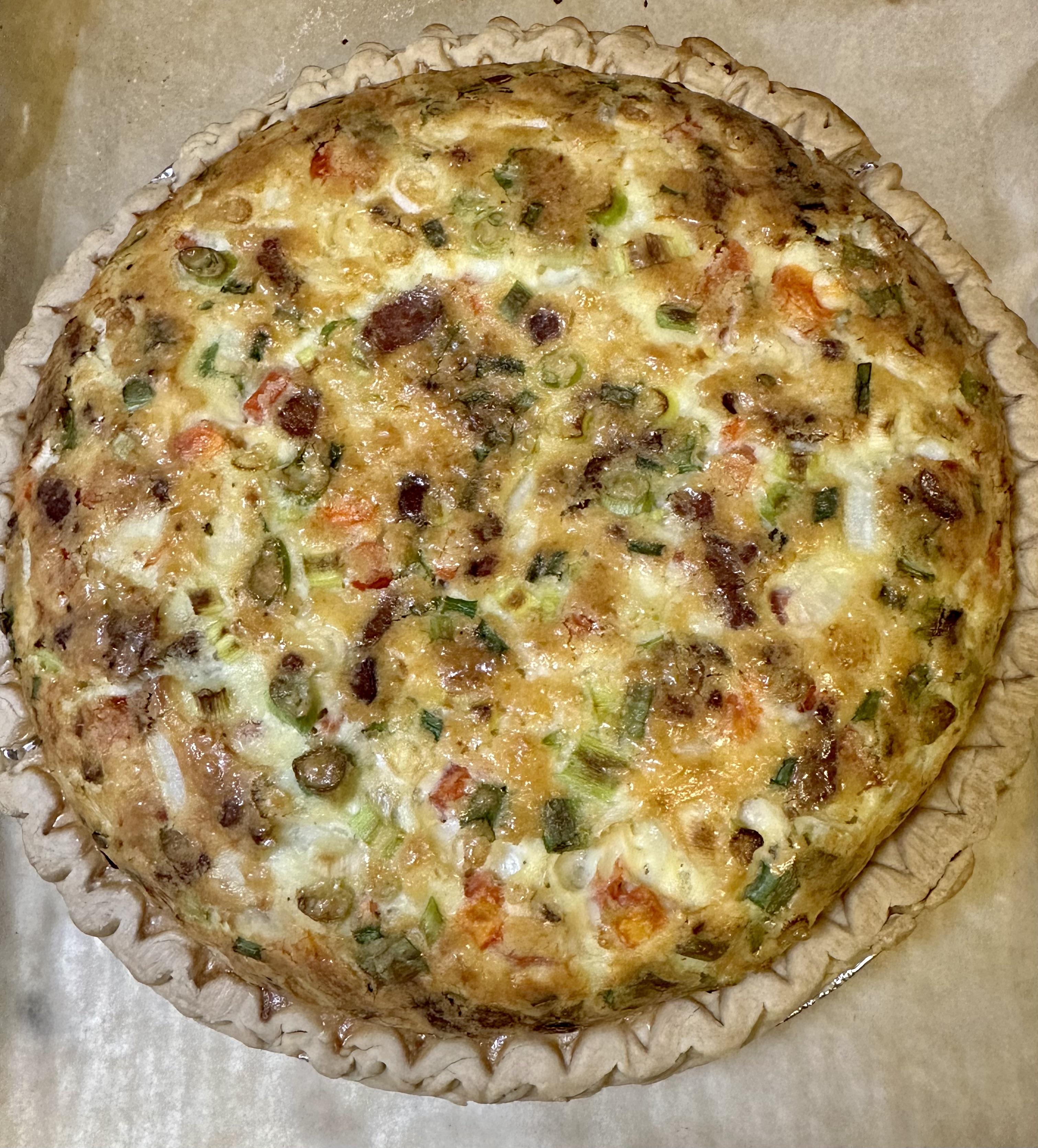 [homemade] Quiche with chopped scallions, chives, white onion, and Roma tomatoes, shredded white ...