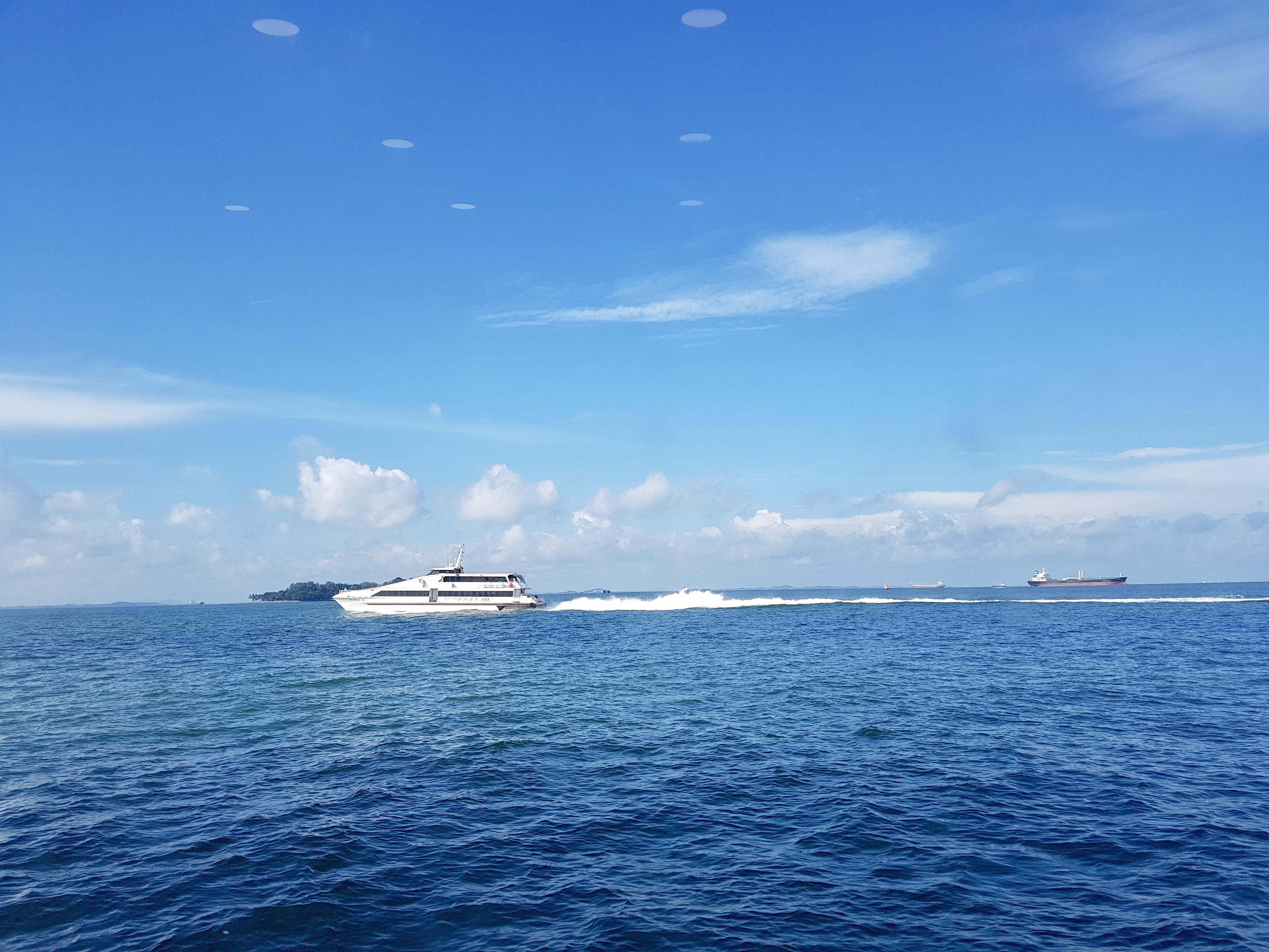 Just a ferry passing by, Singapore | Scrolller