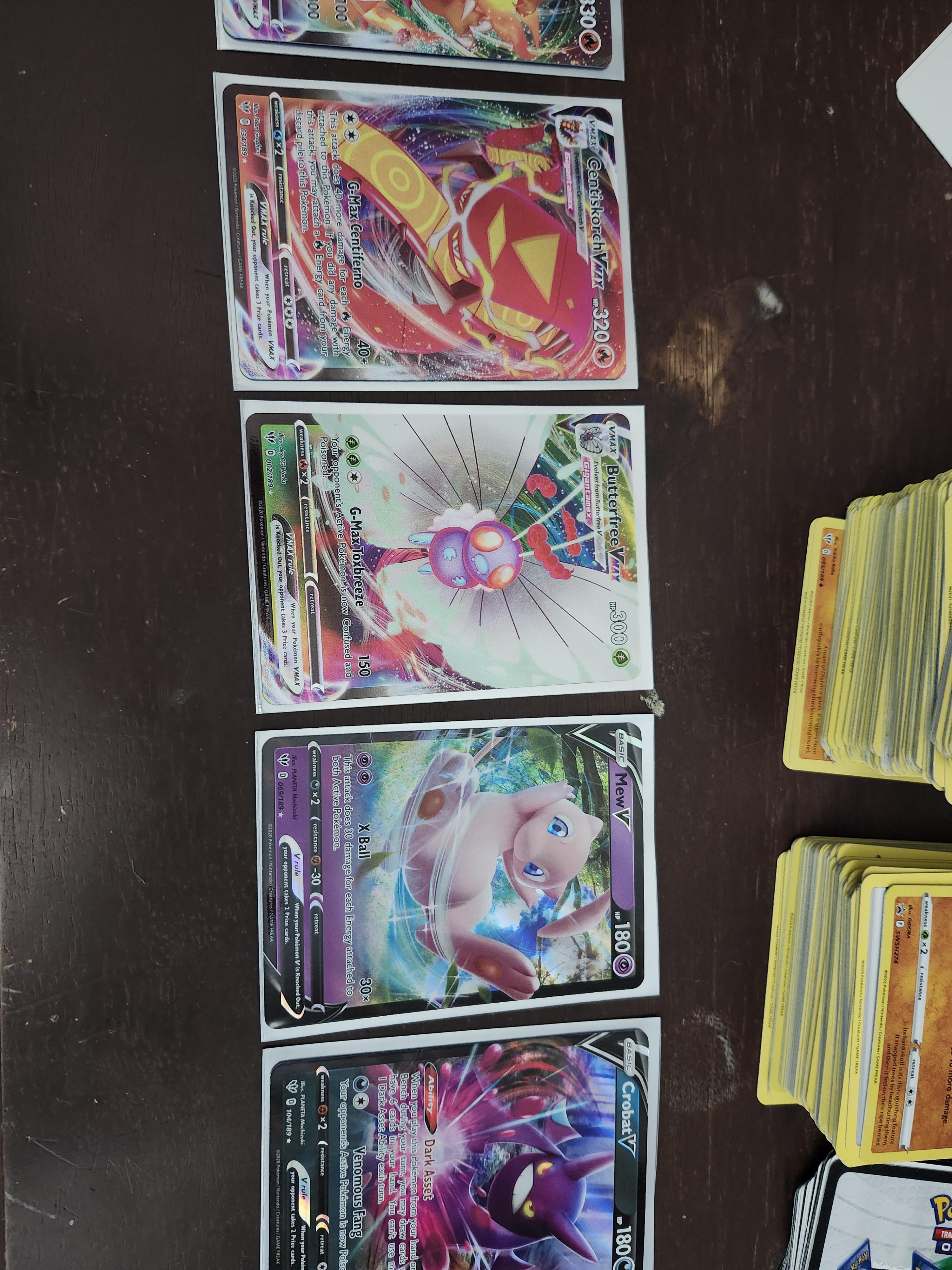 Anyone know the values of these? Mainly the Charizard, thinking about selling them. | Scrolller
