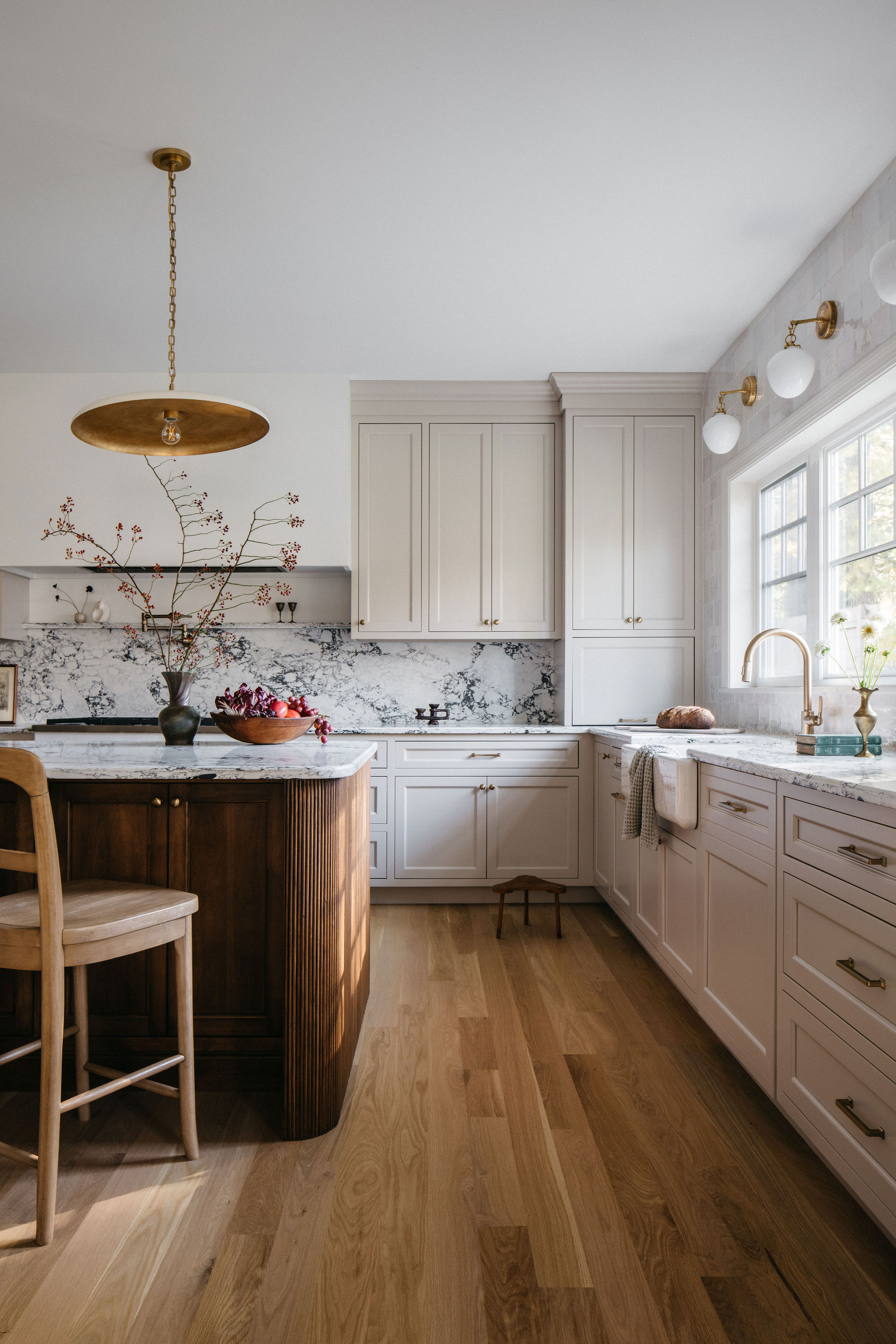 Kitchen with marble backsplash and reeded island in a new home, Clarendon Hills near Chicago ...