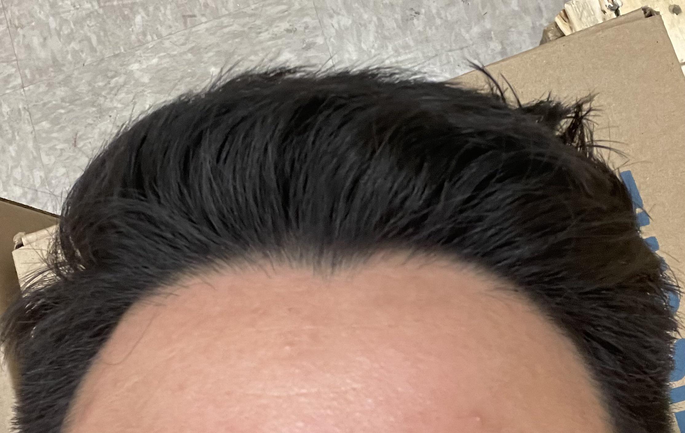 My hair grows up and out. What products can I use to lie it down ...