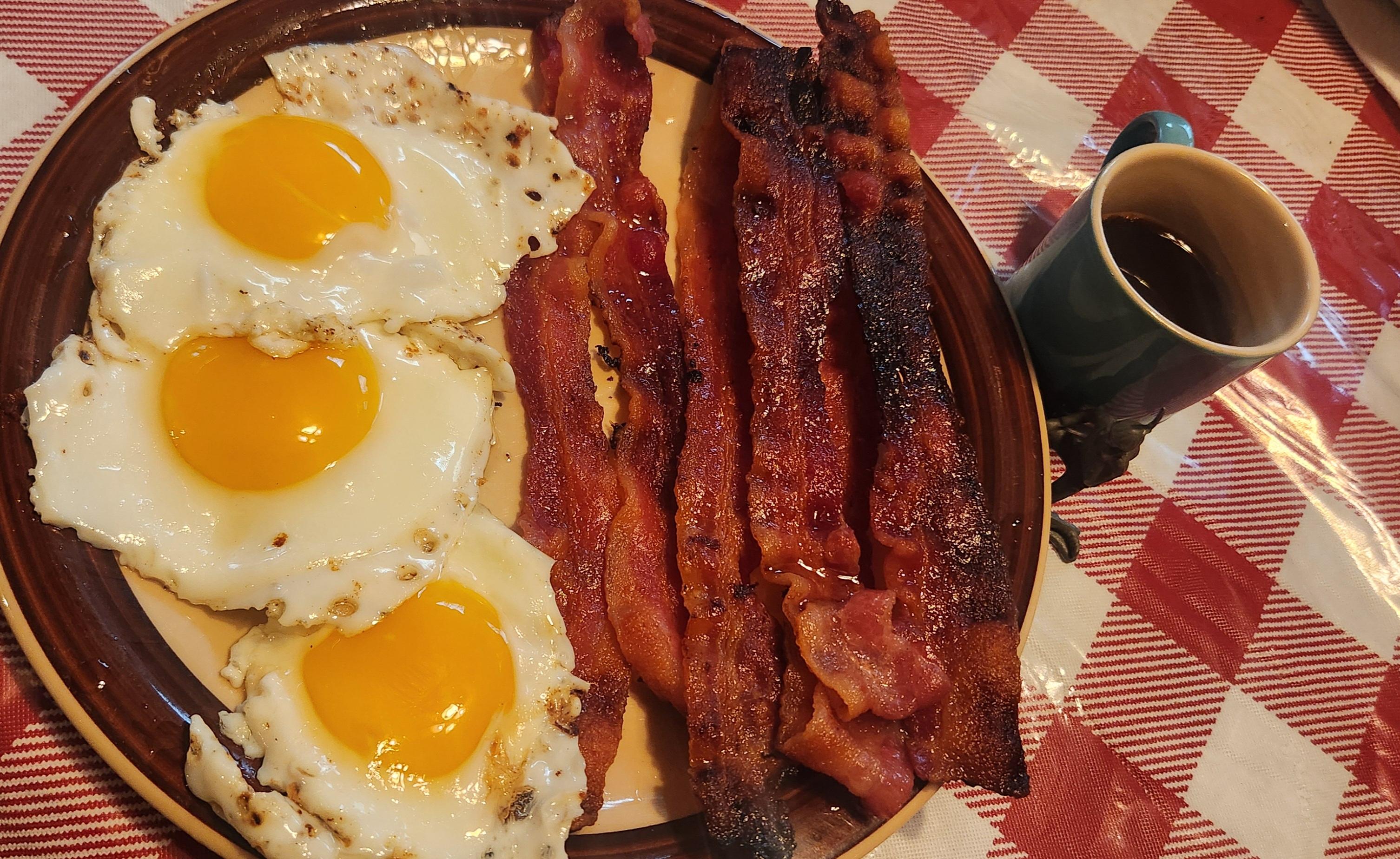 Cast iron eggs fried in hot bacon grease | Scrolller