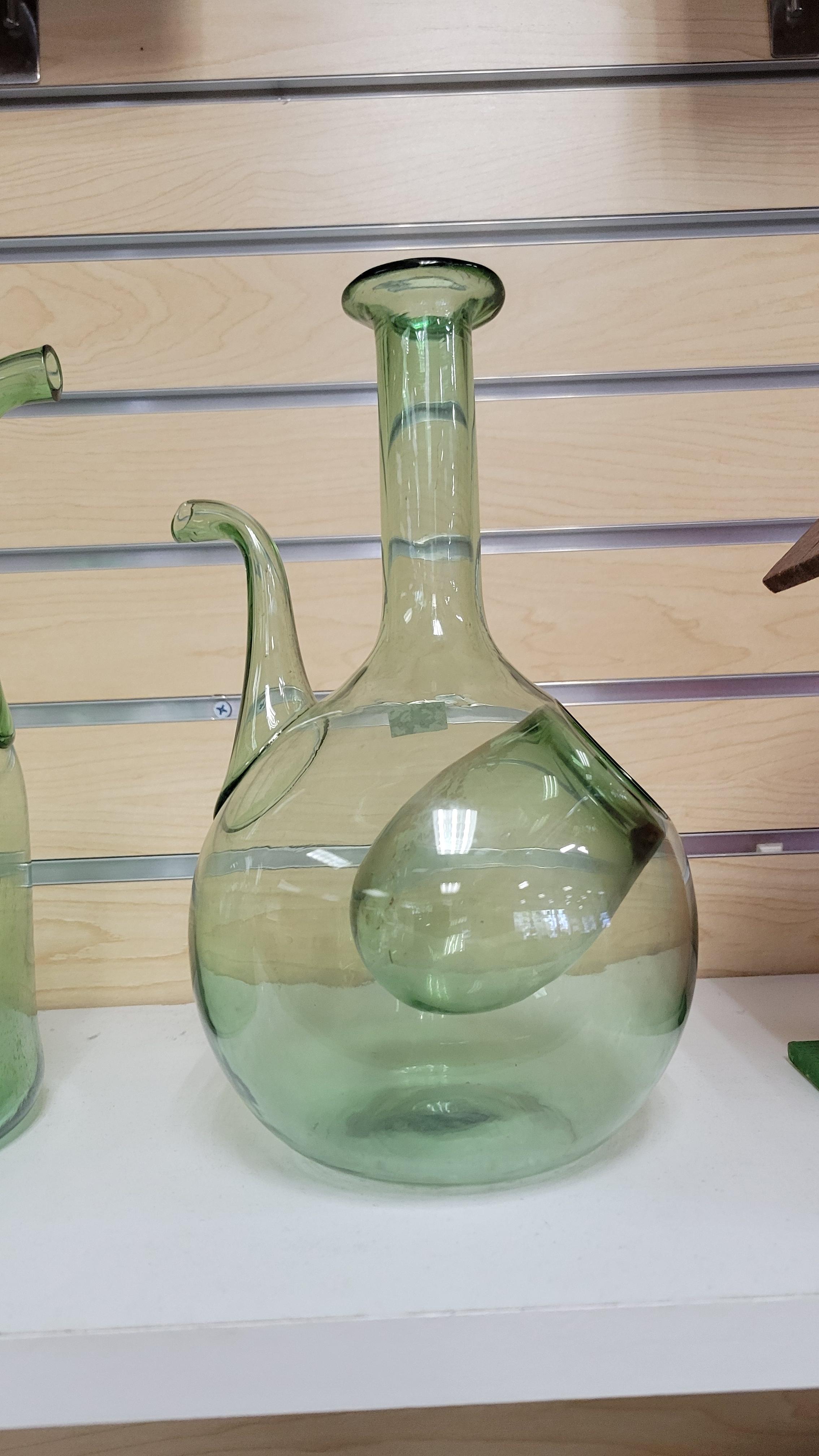 Glass, about the size of a wine bottle. | Scrolller