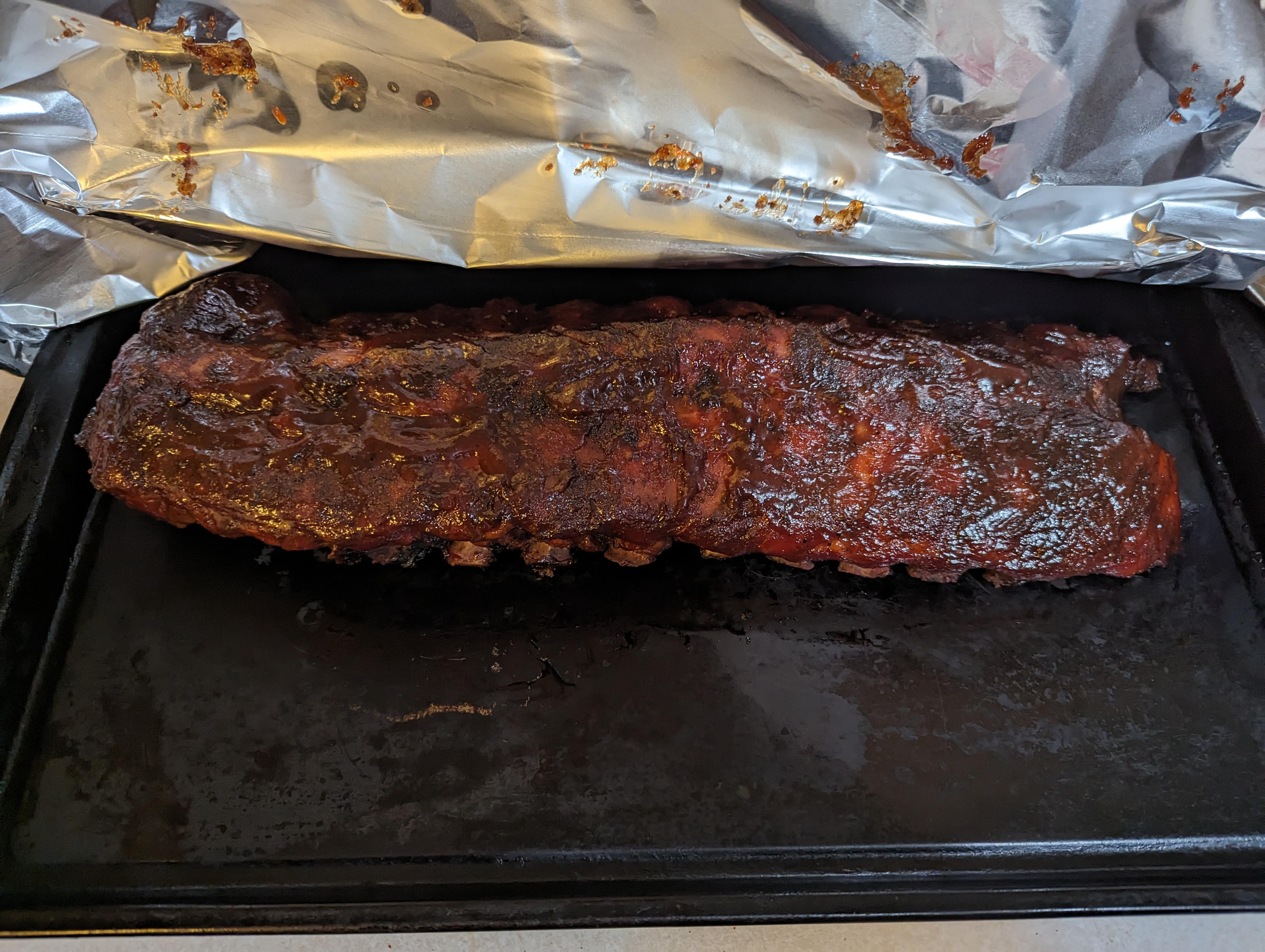[homemade] smoked ribs. Crispy skinned chicken thigh, macaroni and cheese, and baked beans ...
