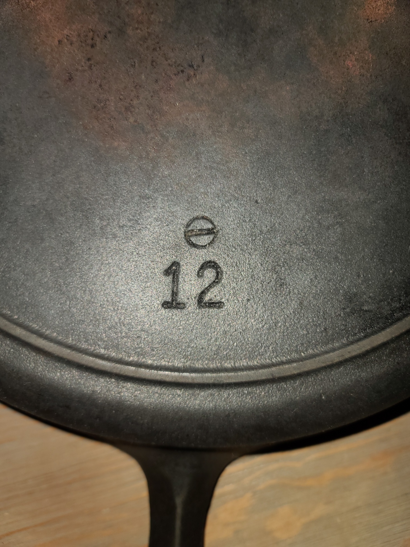 Identification help needed. The marking above the 12 is new to me. | Scrolller
