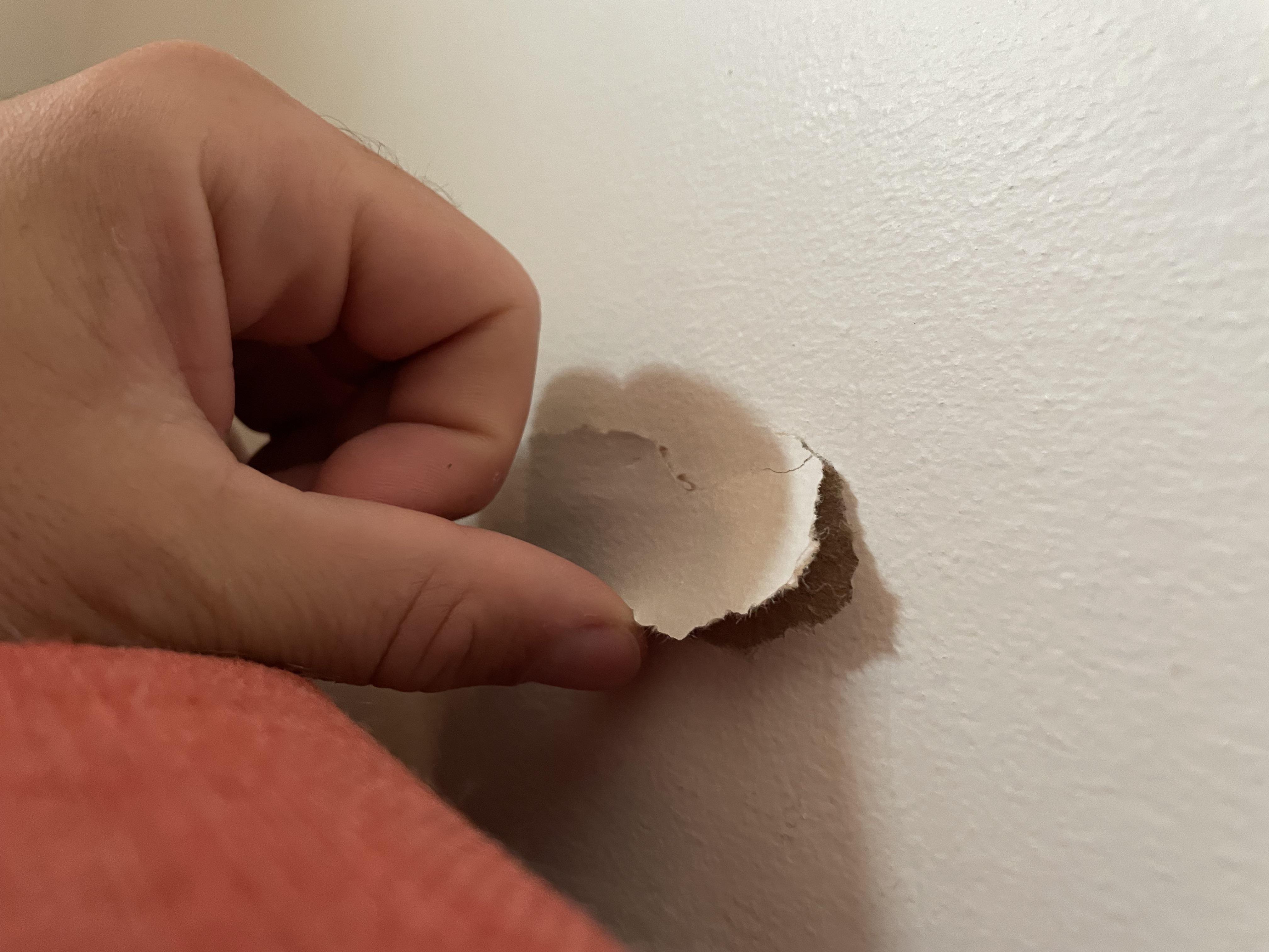 How do I fix this tear in the drywall/paint? | Scrolller