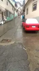 sliding down a hill during heavy rain | Scrolller