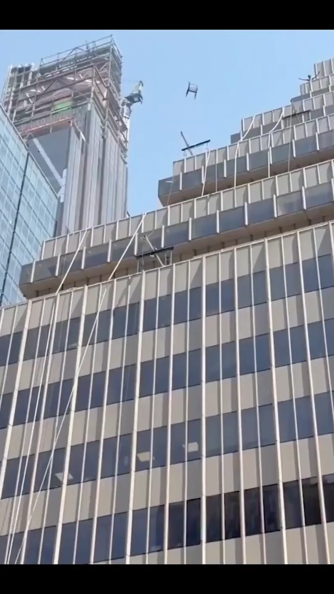 Someone throwing furniture from the top of a midtown Manhattan building onto the busy street ...