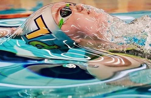 Perfectly timed photos of swimmers just before the water's surface tension is broken. | Scrolller