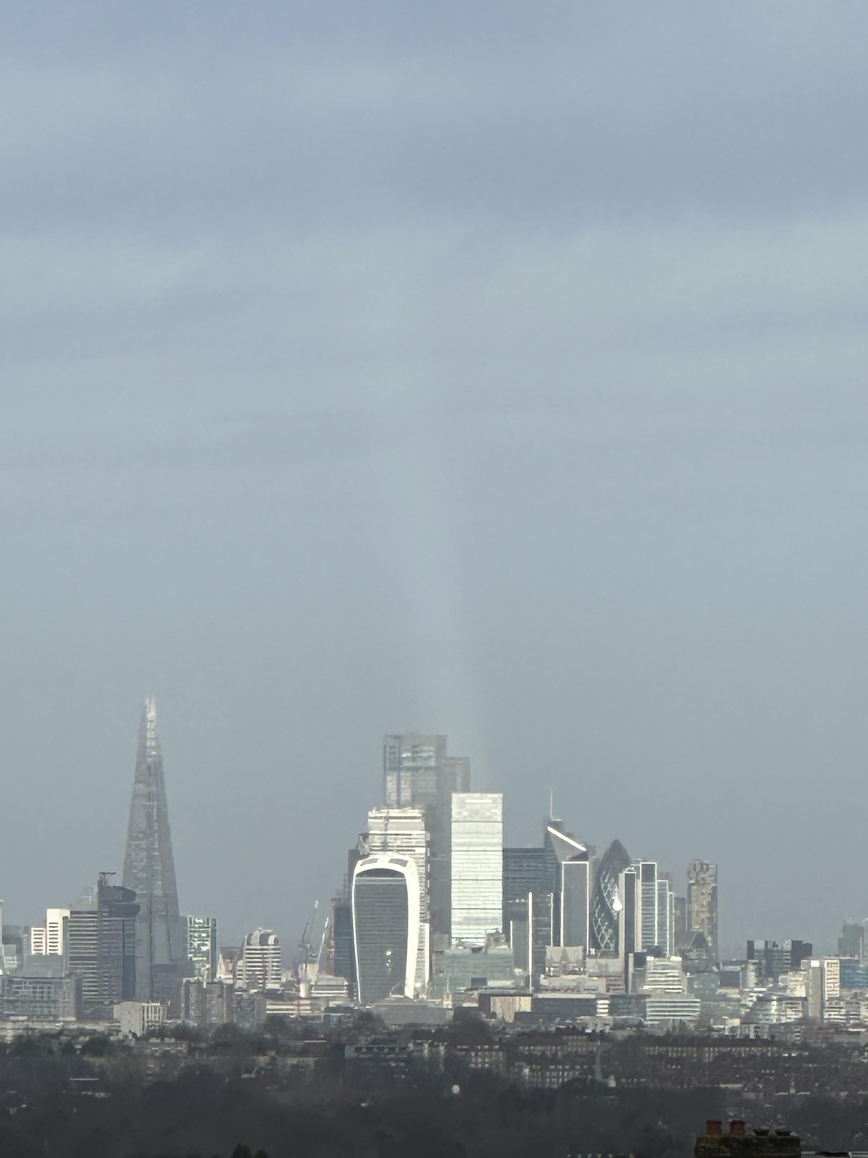 What is this giant white column over city? | Scrolller