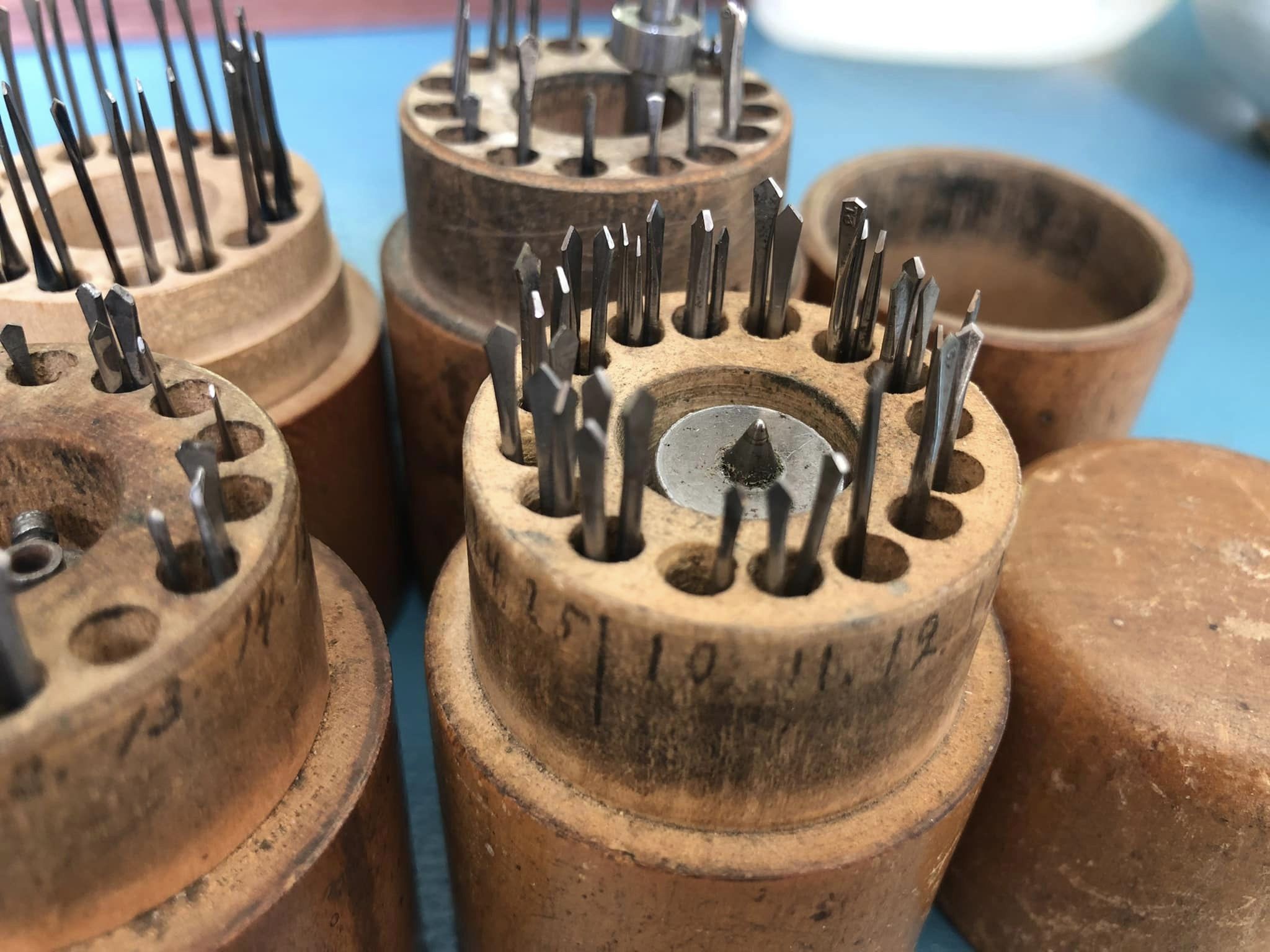 Sets of small tools, each with a holder that looks like it attaches to something larger ...
