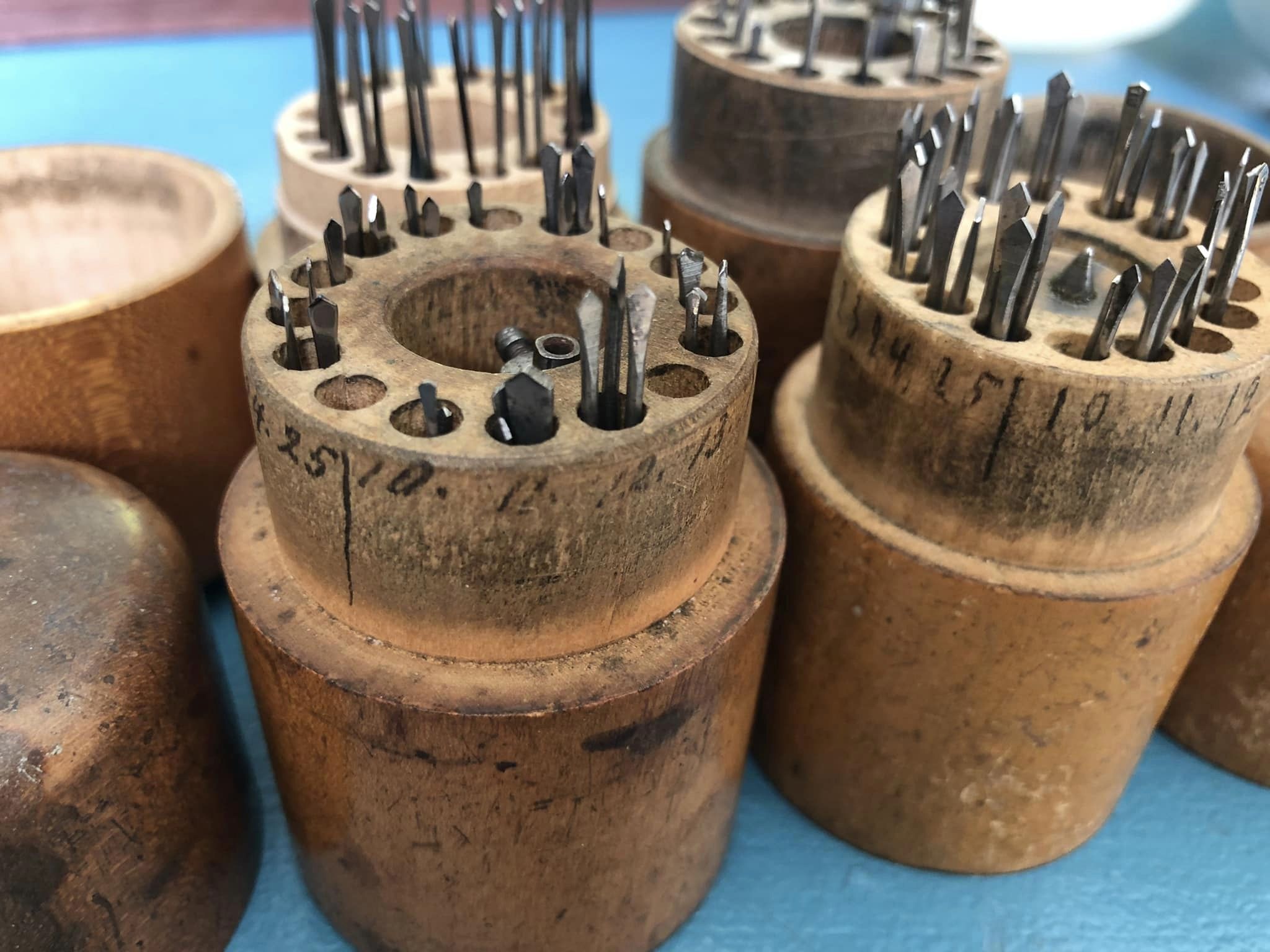 Sets of small tools, each with a holder that looks like it attaches to something larger ...