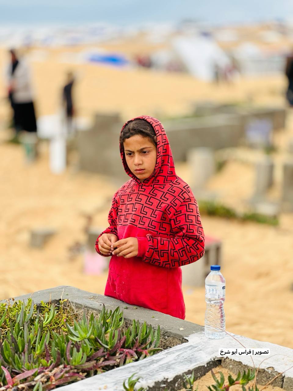 Scenes from a cemetery in Rafah, where hundreds flocked to visit family members, who were ...