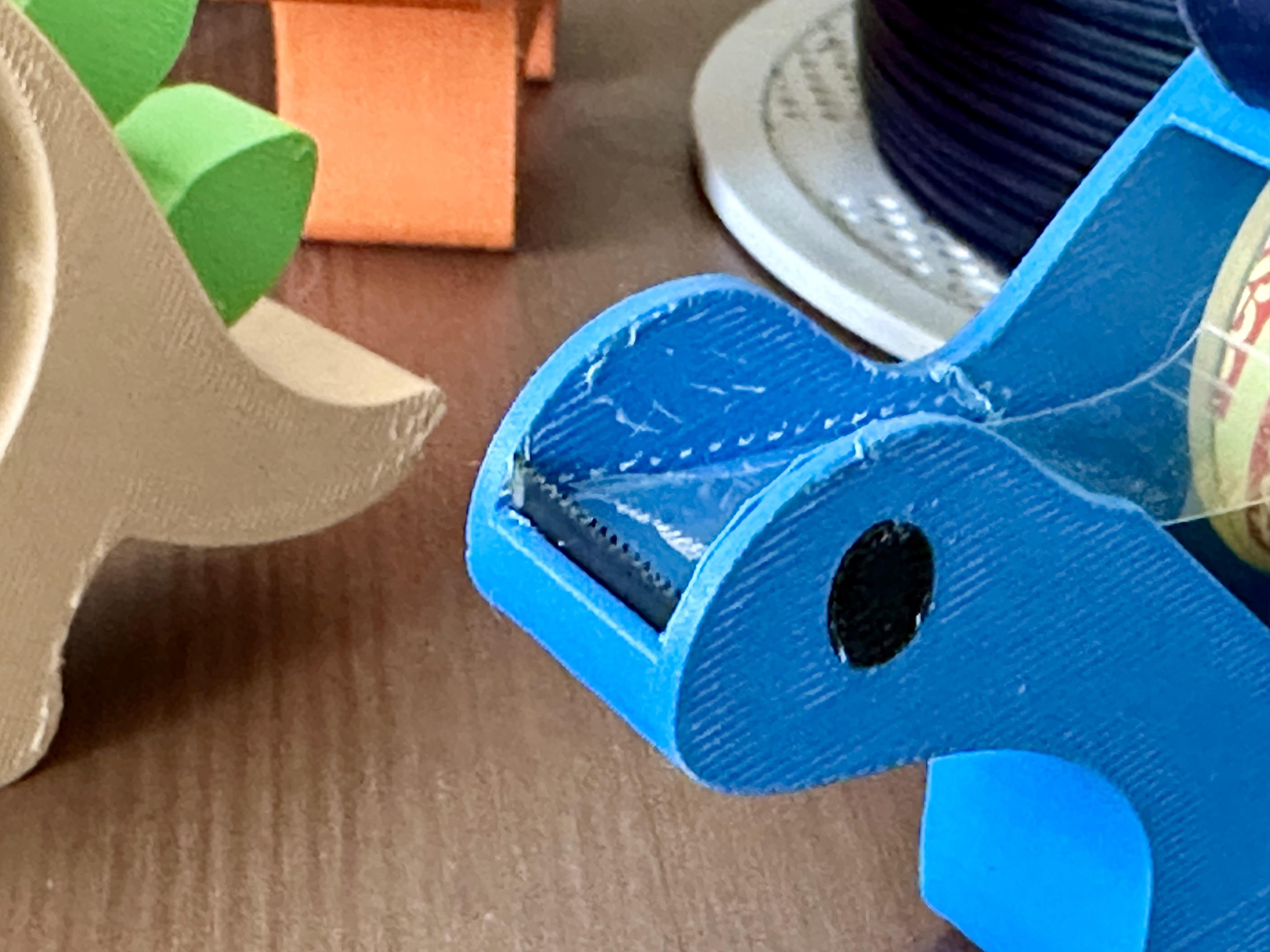 Made a version of my dinosaur tape dispenser that cuts tape better and has the option for a ...