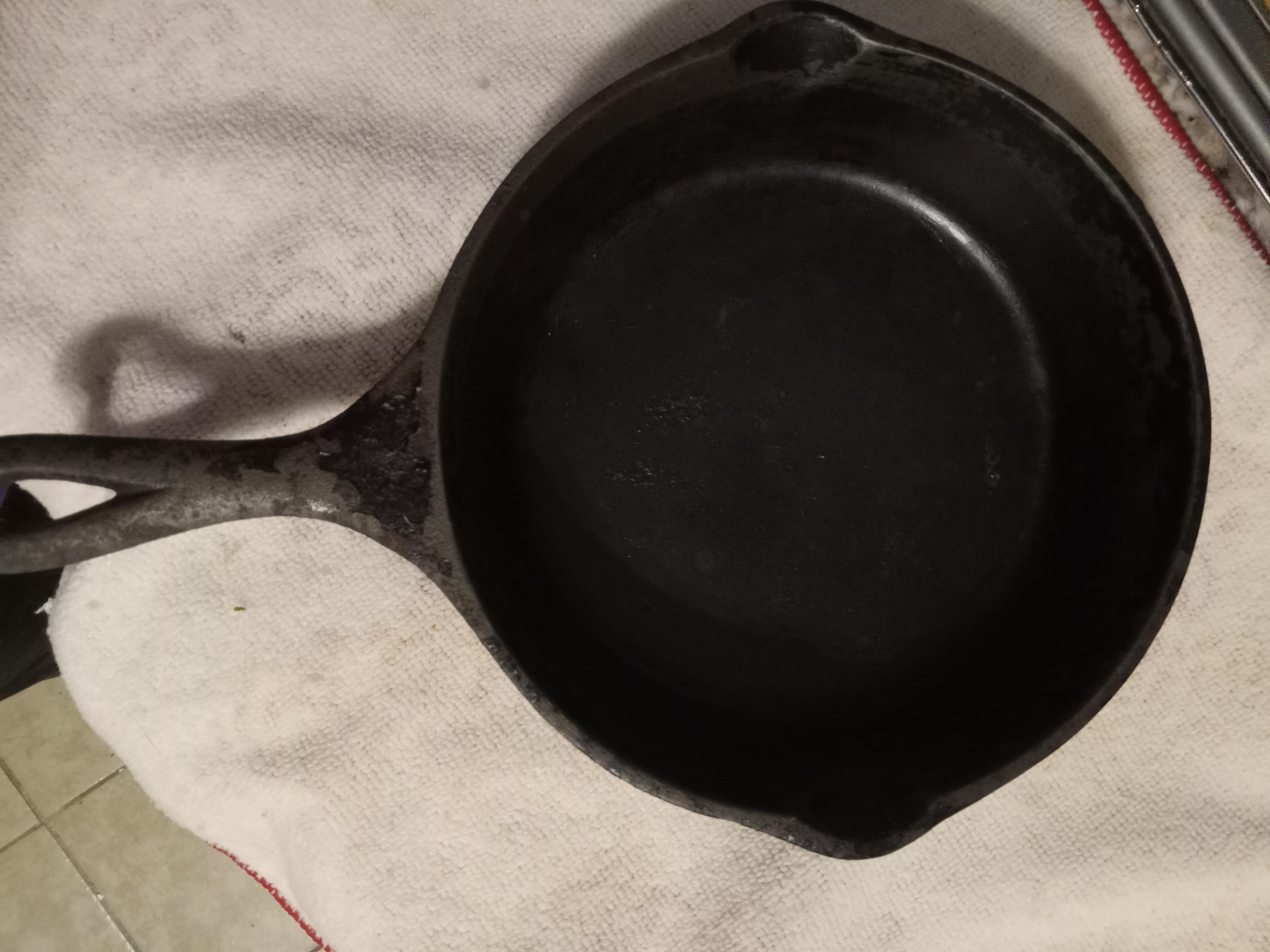 What is my pan doing? Is it paint or carbon seasoning flaking? | Scrolller