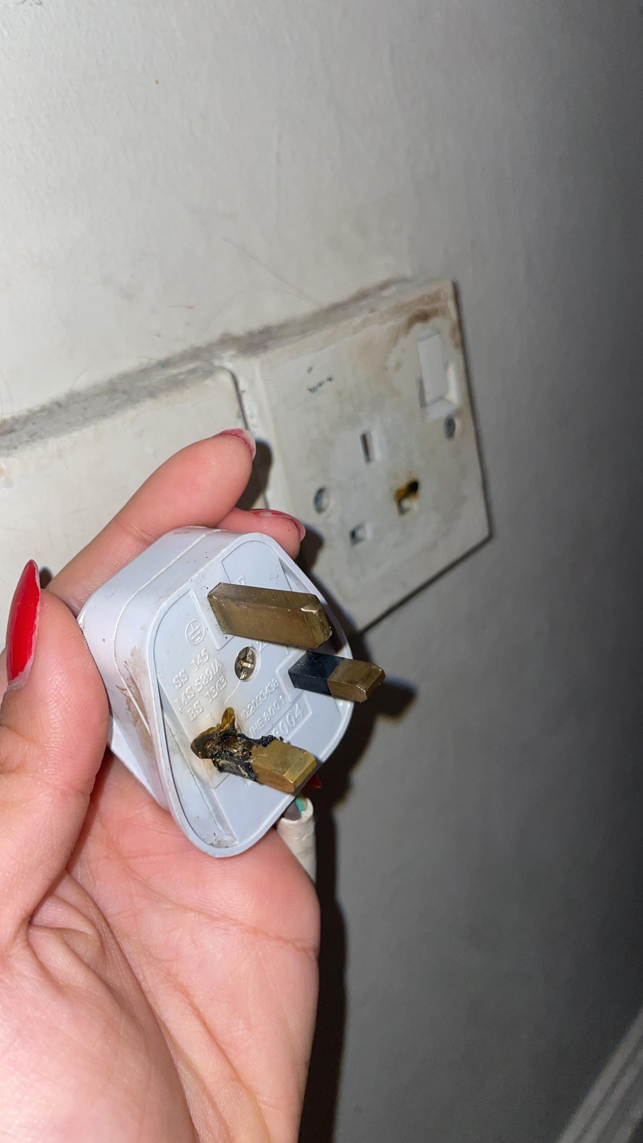 Is this wall socket still safe to use as it is? It's the plug of an extension cord in the second ...
