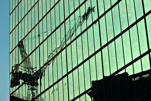 Crane reflected in the hancock | Scrolller
